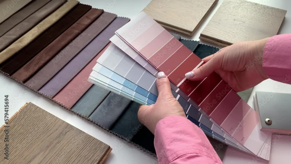 Top view: female interior designer chooses from color palette the best ...