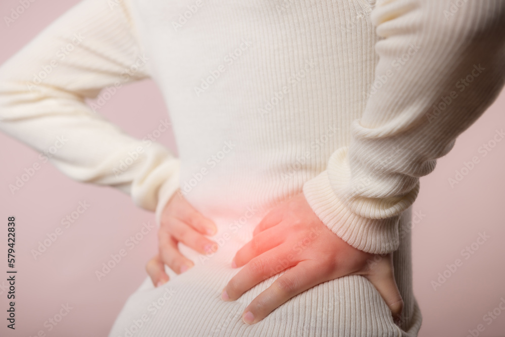 Young woman have waist pain, back ache, lumbar muscle injury problem ...