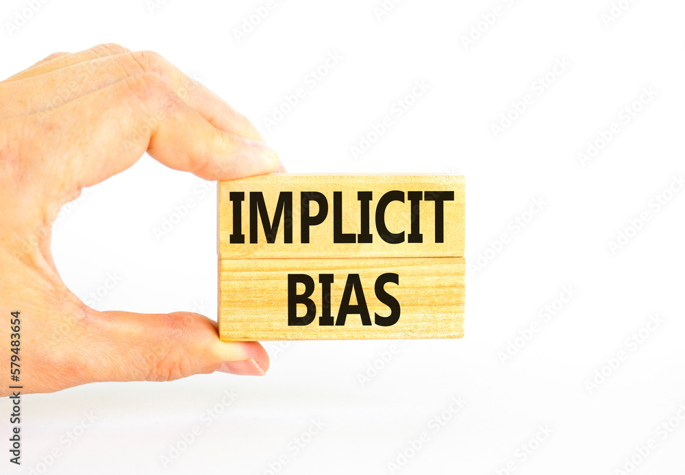 Implicit bias symbol. Concept words Implicit bias on wooden block. Beautiful white table white ...