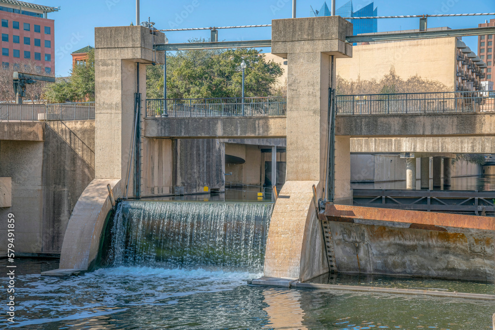 Water flowing on the open flood gate at San Antonio River- River Walk ...