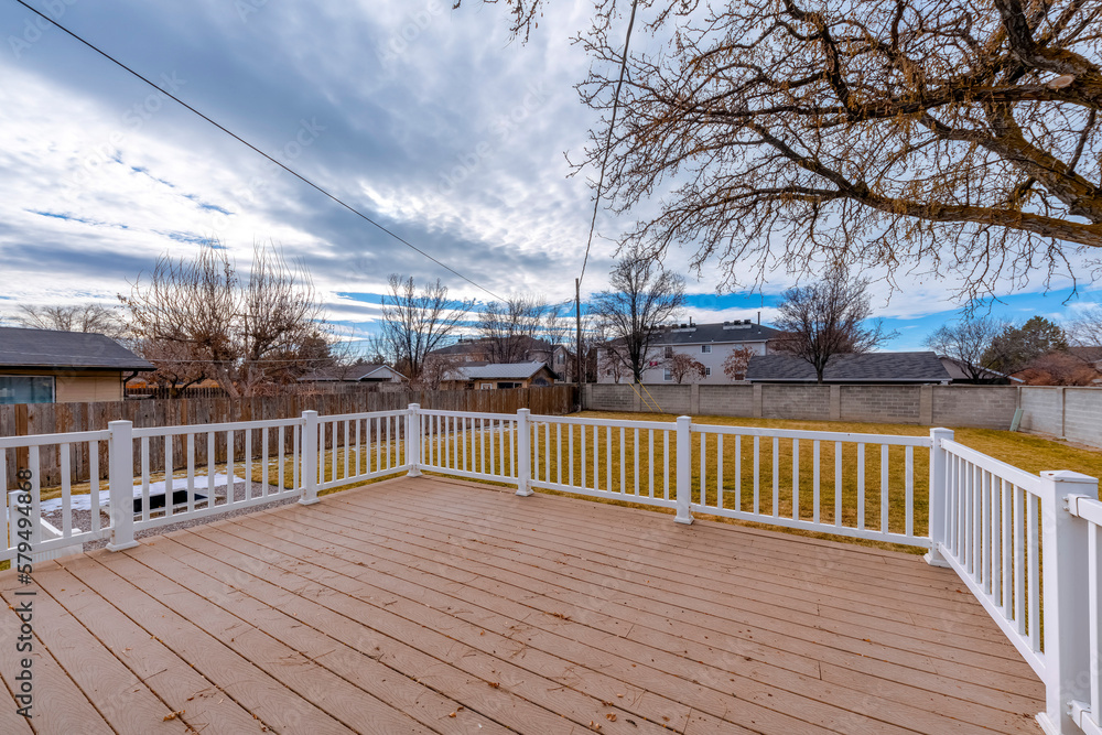 Wood fence and concrete wall fence views from the wooden deck with ...
