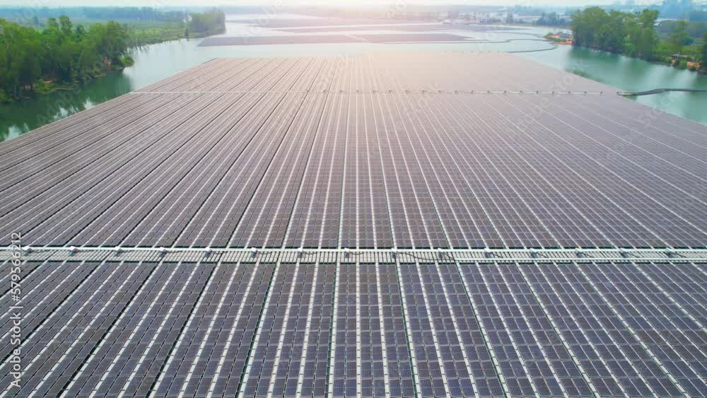 Floating solar panels can appear as a large array of flat, rectangular ...