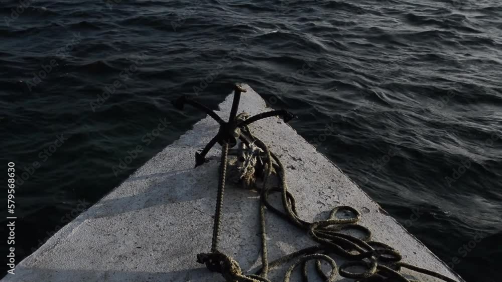 FPV of a shipwrecked man alone on a raft in the middle of the sea, lost ...