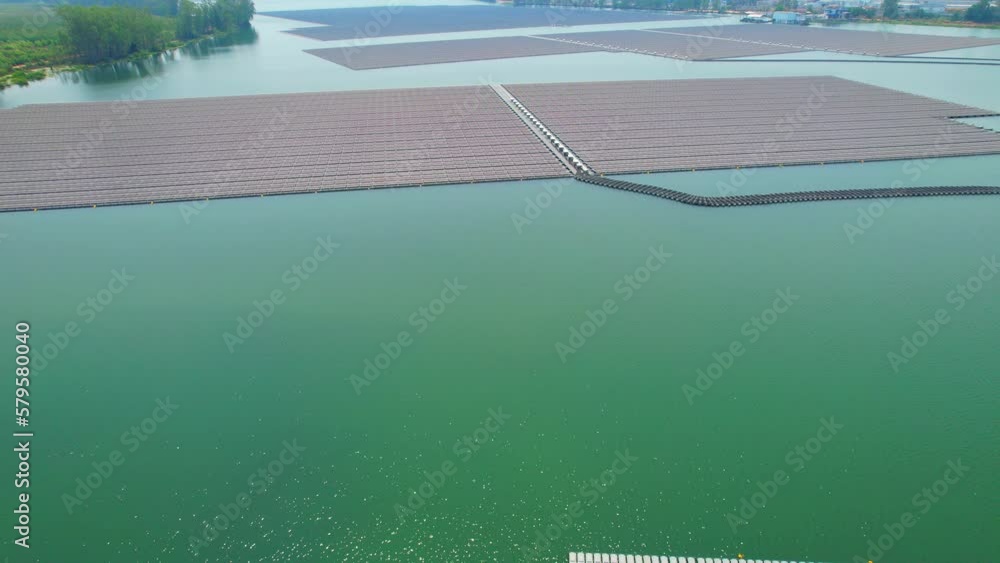 Flying over a solar panels floating on water. It installing solar ...