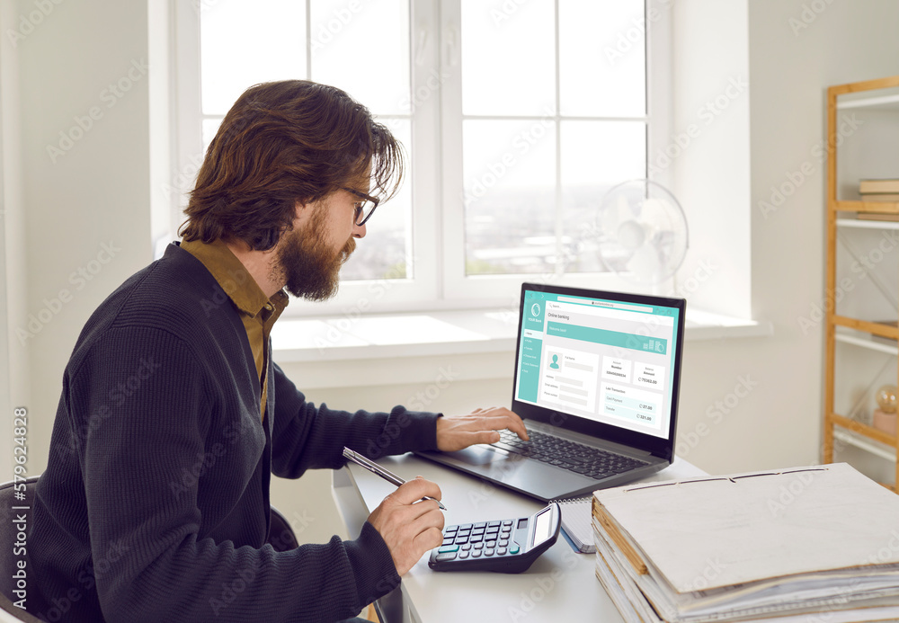 Busy man working in his business office. Young businessman sitting at ...