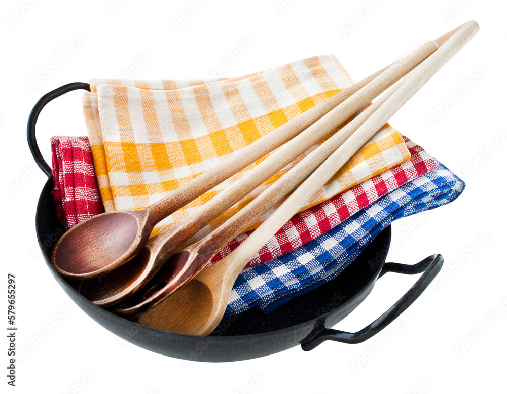 Frying pan and kitchen towels with cooking spoons isolated on ...