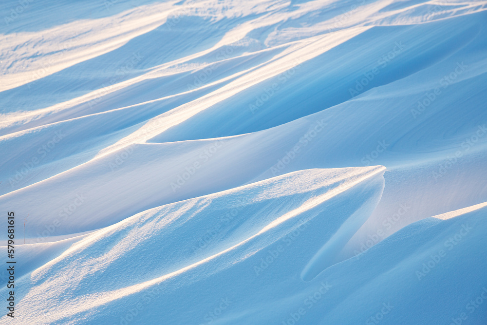 Snow texture. Wind sculpted patterns on snow surface. Wind in the ...