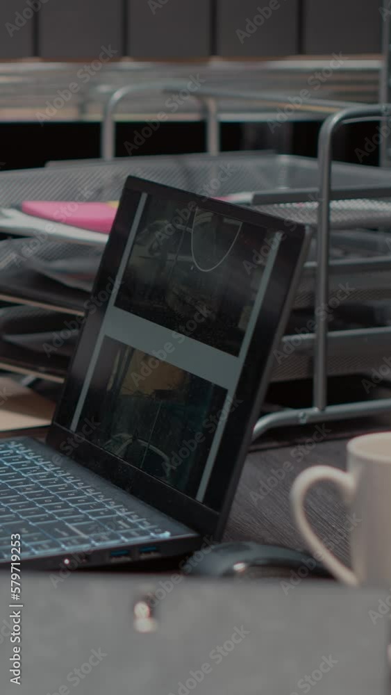 Vertical video: African american man examining photos on laptop ...