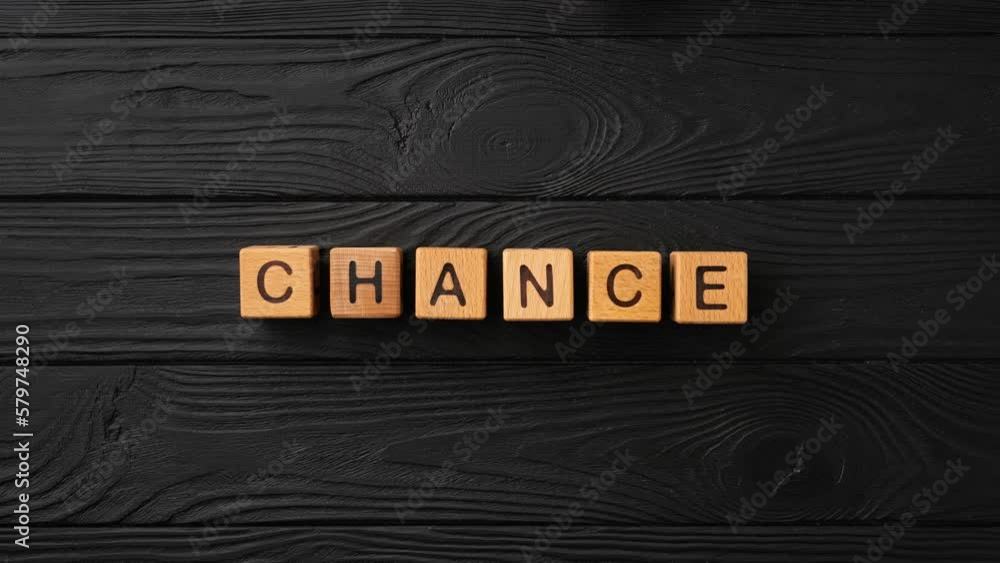 Wooden cubes with letters and the word Chance move and change to the ...