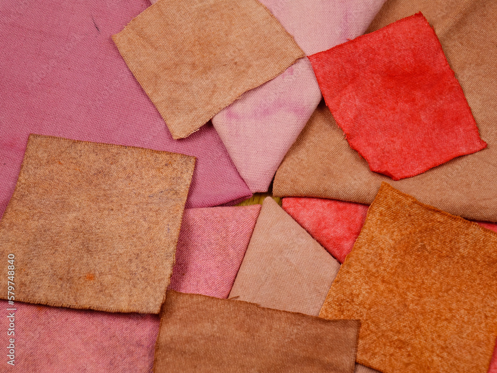 Samples of cotton fabric in light- dark red gradient, background ...