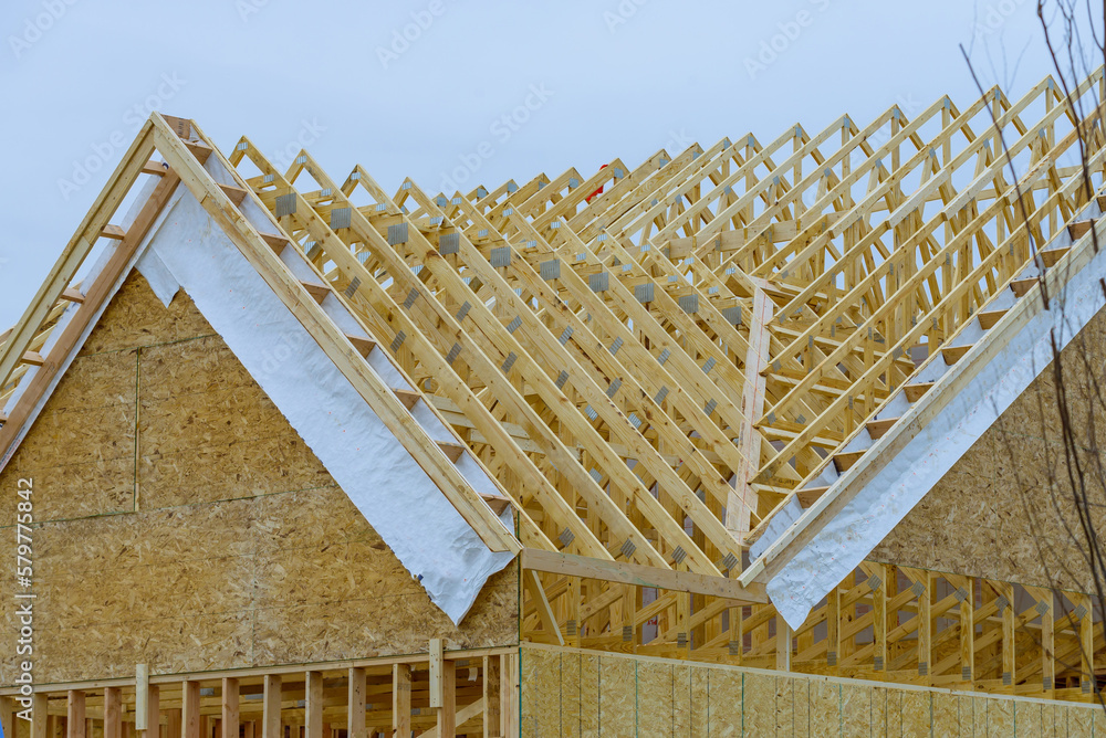 installation of rafters of a plywood house building wall studs wooden Stock Photo | Adobe Stock