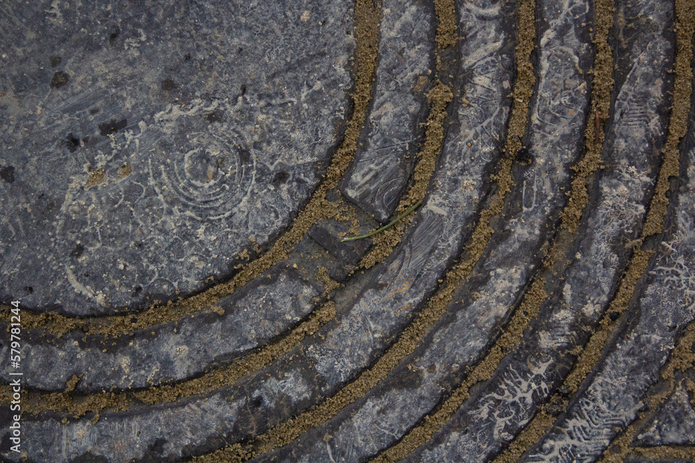 Top view. Metal worn surface of old sewer manhole. Round arc geometric ...