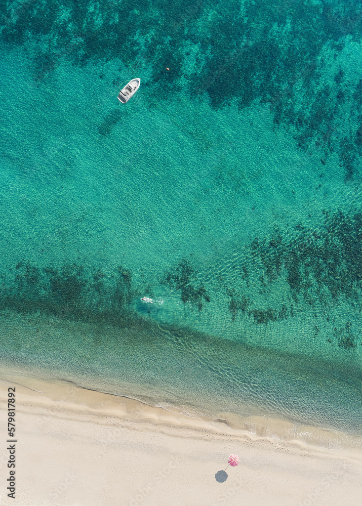 Aerial view of a beautiful sea destination with a person swimming in ...