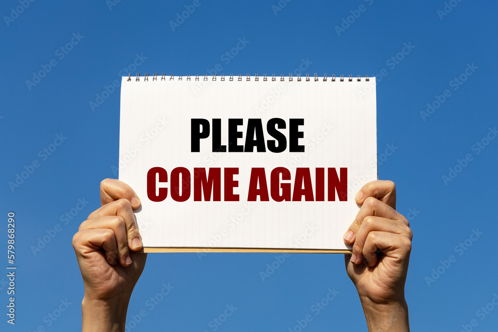 Please come again text on notebook paper held by 2 hands with isolated ...