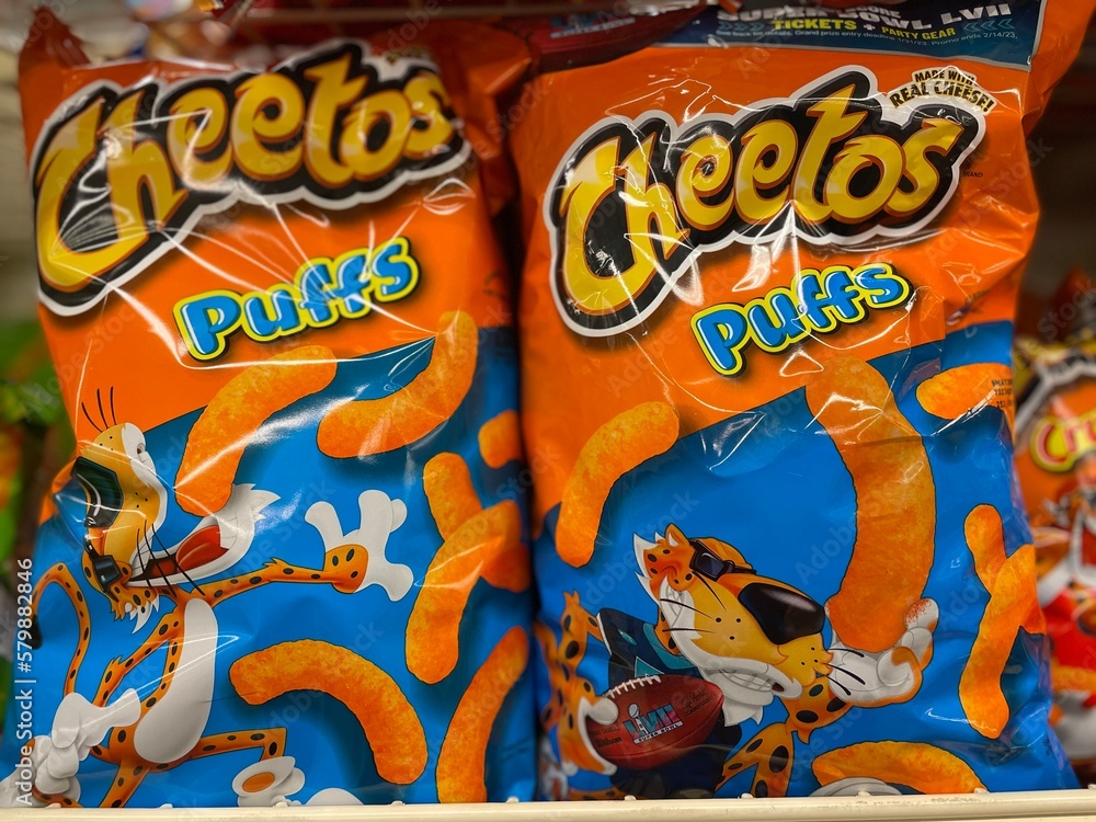 Grocery store Cheetos puffs rows on shelf Stock Photo | Adobe Stock