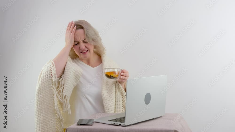 sensitive teeth to hot and cold looking at the screen monitor holding ...