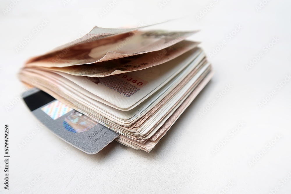 Thai baht cash money and credit card on white background, concept of ...