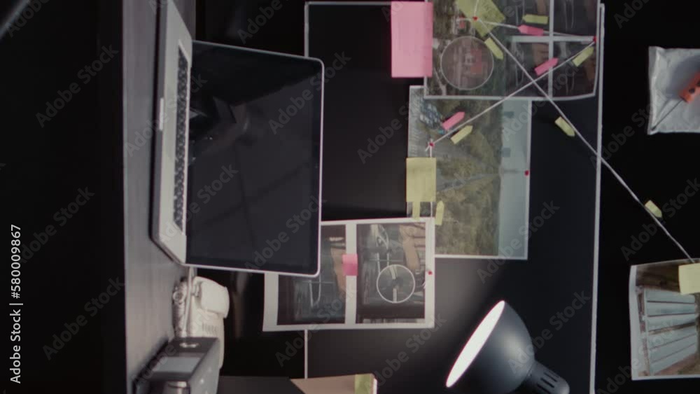 Vertical video: Evidence board with case files or investigation clues ...