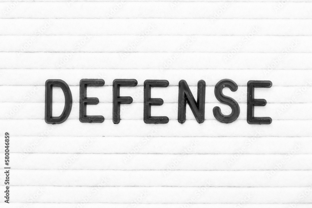 Black color letter in word defense on white felt board background Stock ...