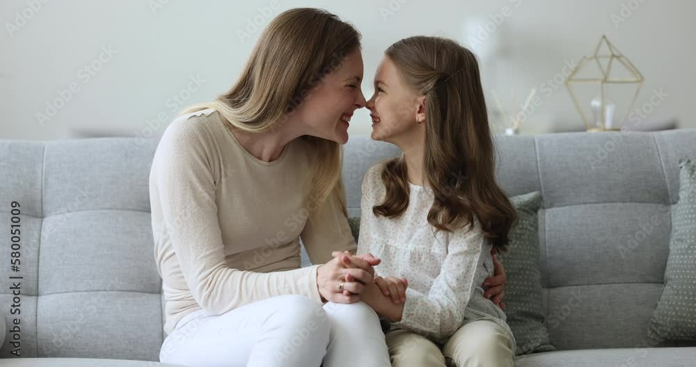 Happy adoring mom caressing cheerful cute daughter kid, hugging ...