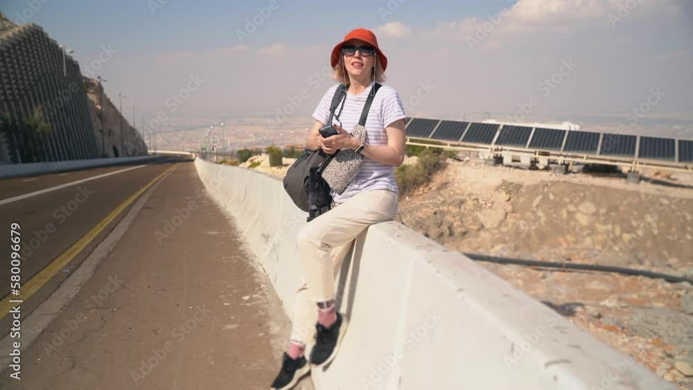 Young auto woman stops on road outdoors spbas. Beautiful Caucasian ...