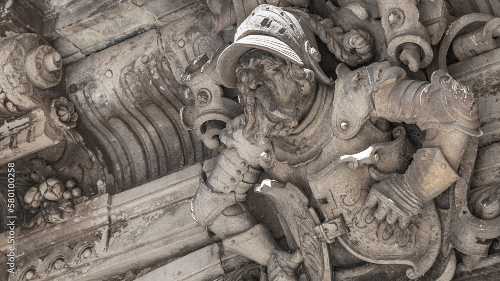 Ancient sculpture of scary, fearful and heavy armed gatekeeper ...