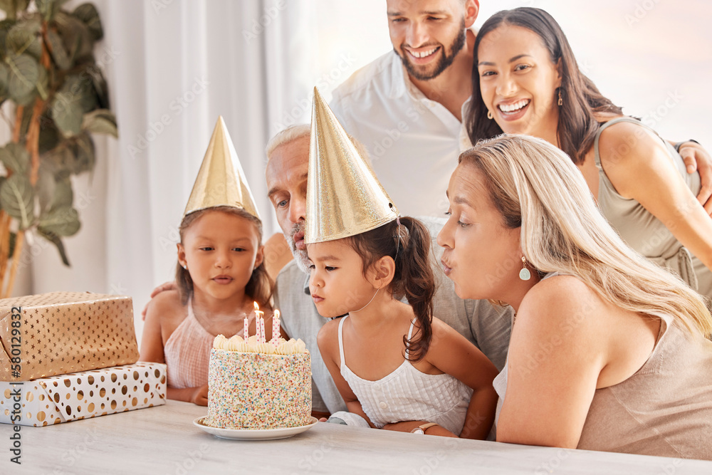 Family, kids and birthday cake with a child and her big family ...