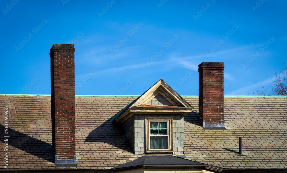 Old building gable roof brick chimneys and dormer window, Boston, MA ...
