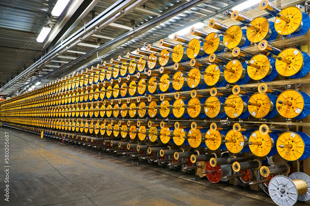 Foto de Bobbins coil thin wire to reinforce tires in plant workshop do ...