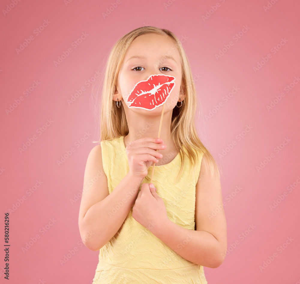 Portrait, children and lips with a girl on a pink background in studio ...