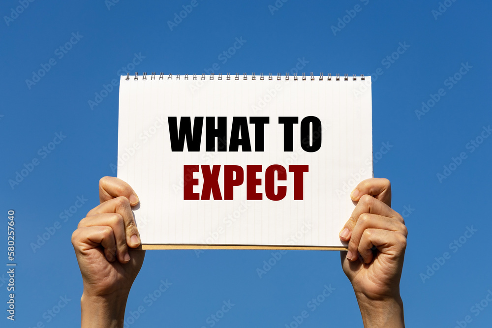 What to expect text on notebook paper held by 2 hands with isolated ...