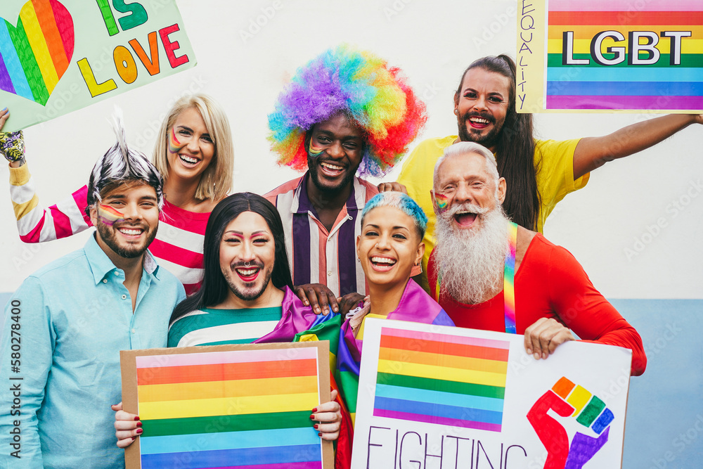 Gay people having fun at pride parade with LGBT banners outdoors ...