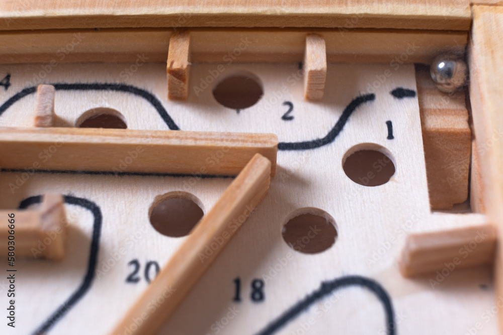 Foto de Wooden labyrinth toy marble maze game. Ball bearing navigating ...