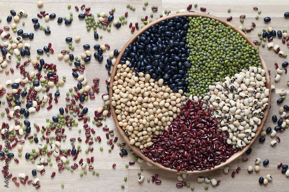 Top view of five colored beans in a bowl on wooder background, Healthy ...