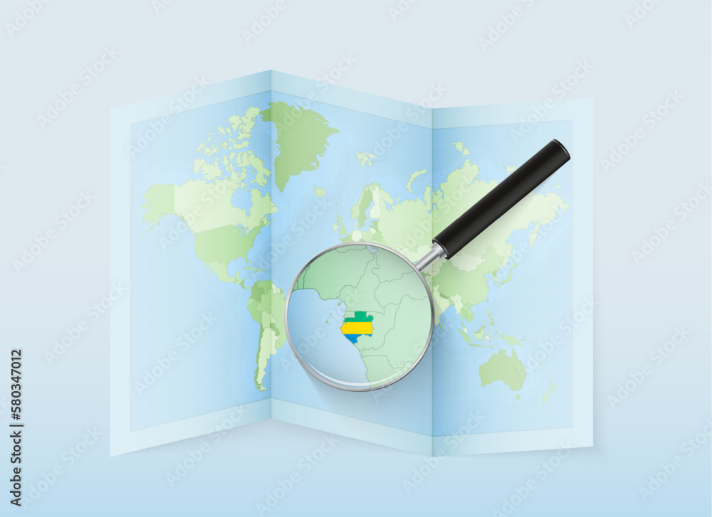 A folded world map with a magnifying lens pointing towards Gabon. Map and flag of Italy in loupe ...