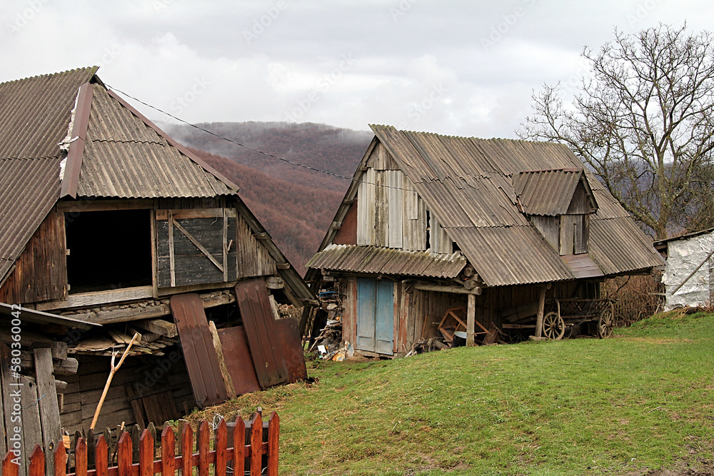 Abandoned old outbuildings for livestock in a mountain village in the ...