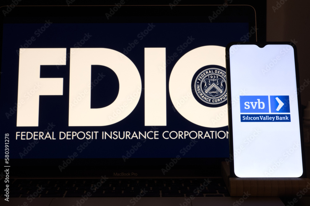 Smartphone with SVB ( Silicone Valley Bank ) logo on background of FDIC ...