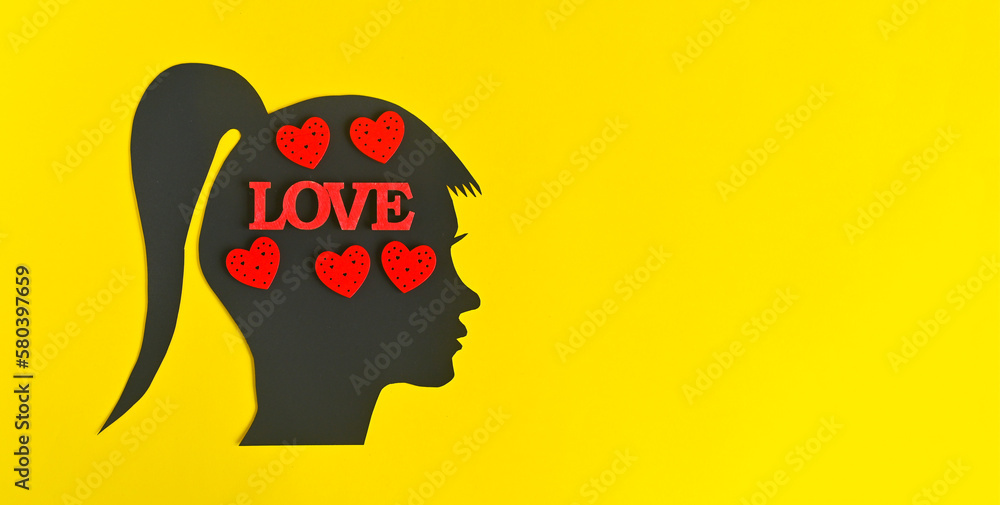 the girl's head is cut out of paper. concept. the woman fell in love ...