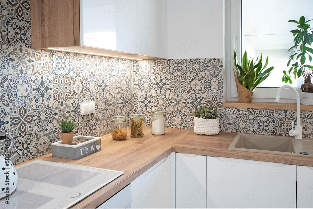 Small kitchen with tiles pattern on the wall, luxurious white furniture ...