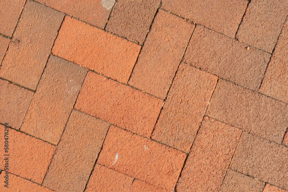 Red interlocking bricks on patio pavement walkway for pedestrians in ...
