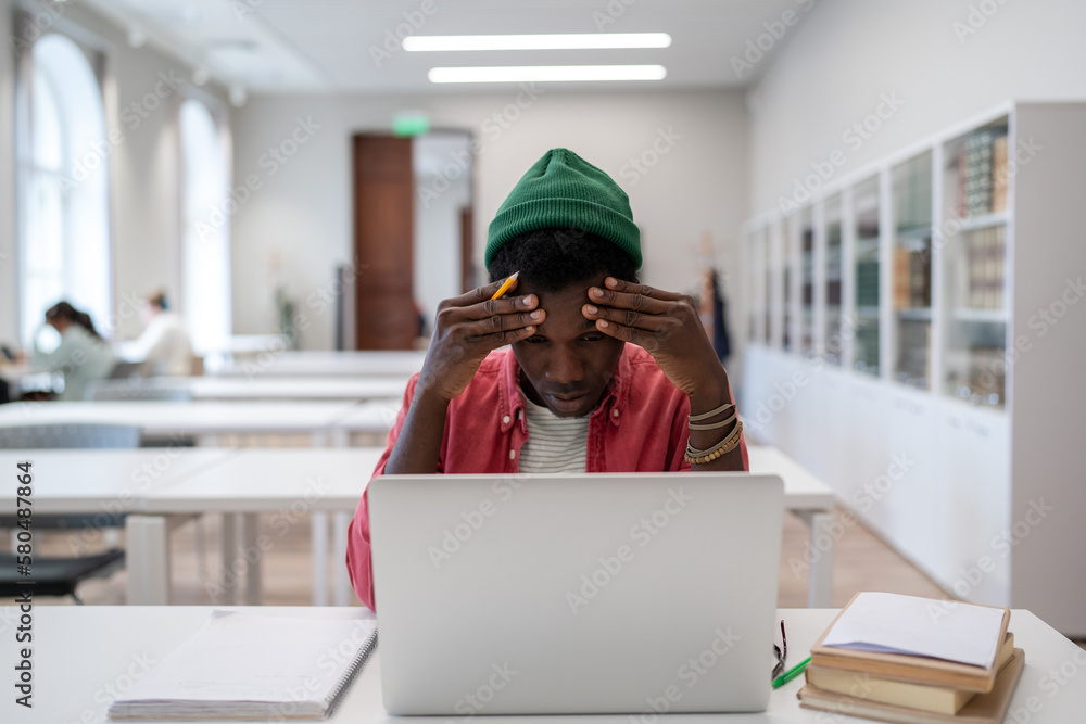 Tired black guy freelancer man with strain tension migraine after ...