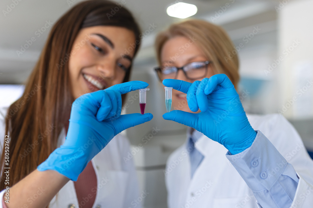 Scientist holding samples into tubes in research laboratory. Advanced ...