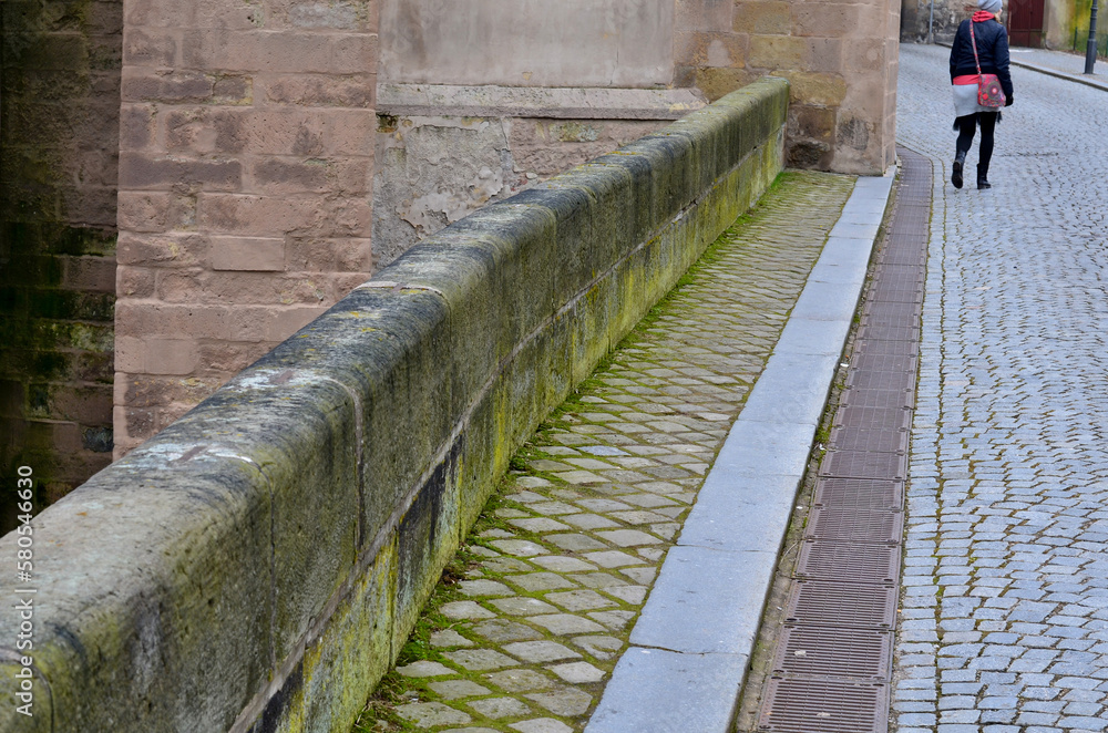 stone balustrade of the bridge at the church made of worked sandstone ...