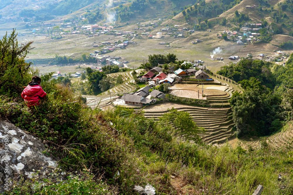 Vietnam, a little girl looks on the Muong Goa Valley with it's ...