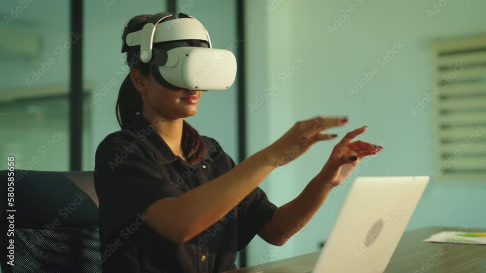 Beautiful indian girl wearing virtual reality headset. Woman playing ...
