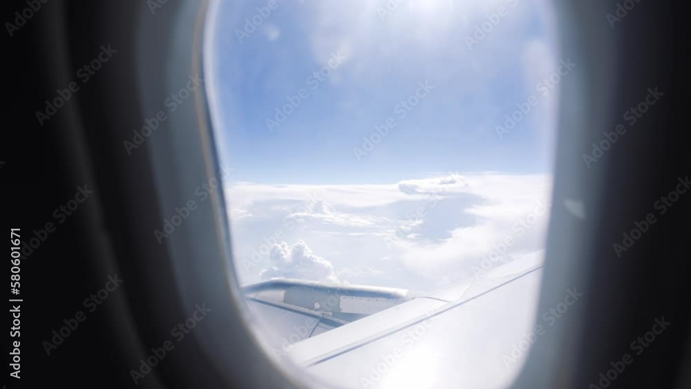 Beautiful view from window of plane on wing. Clear blue sky and white ...