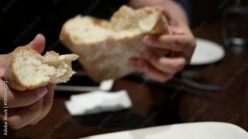 The motion of people eating bread inside The keg steakhouse and bar ...