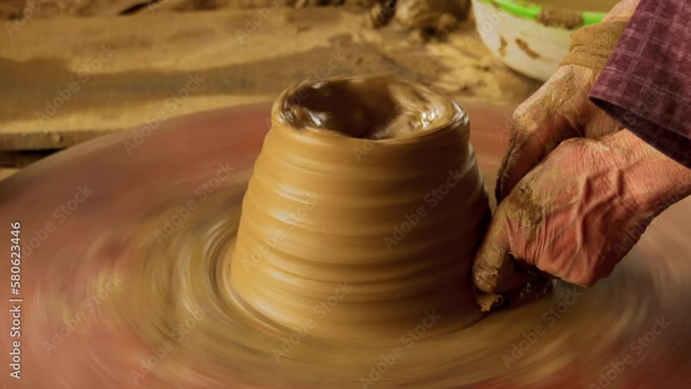 Close-up of the process of making new clay pottery in Thanh Ha ...