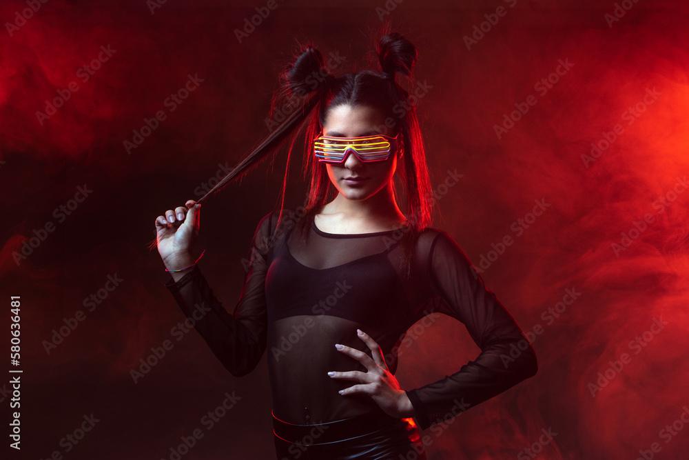 Portrait of beautiful cyber model woman posing wearing led glasses on ...