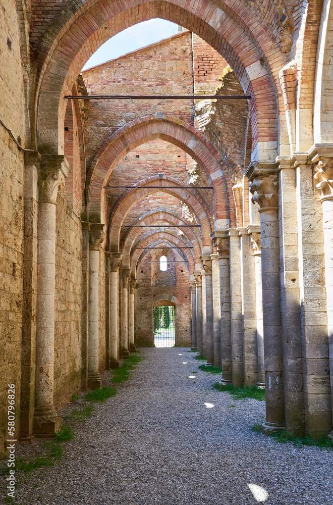 Diminishing perspective of arch pathway amidst architectural columns in ...